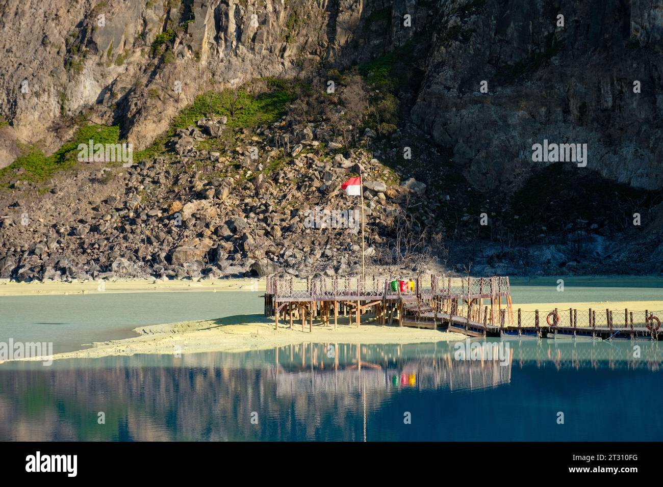 Walk along the proud pathway of a wooden pier inside Kawah Putih Crater ...