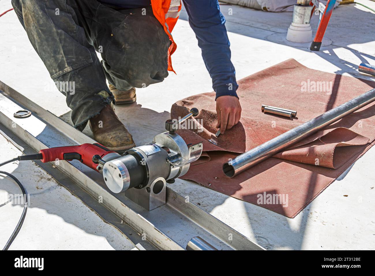 A tube facing and squaring tool is used on stainless steel tubing used ...