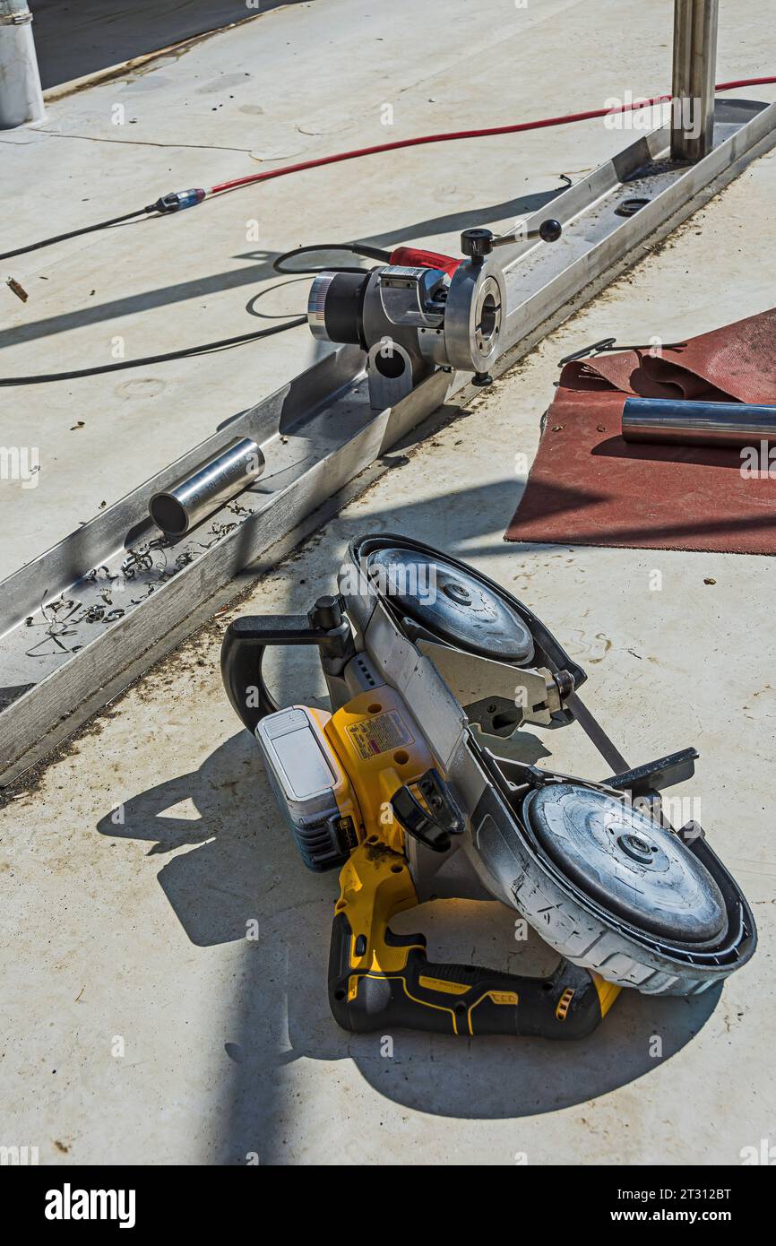 A tube facing and squaring tool, with a portable bandsaw, is used on ...