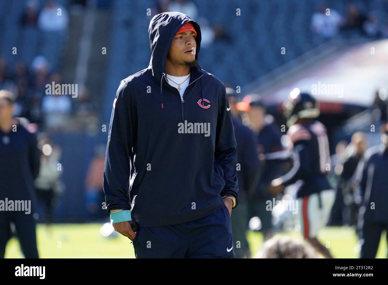 Injured Chicago Bears quarterback Justin Fields walks on the field ...
