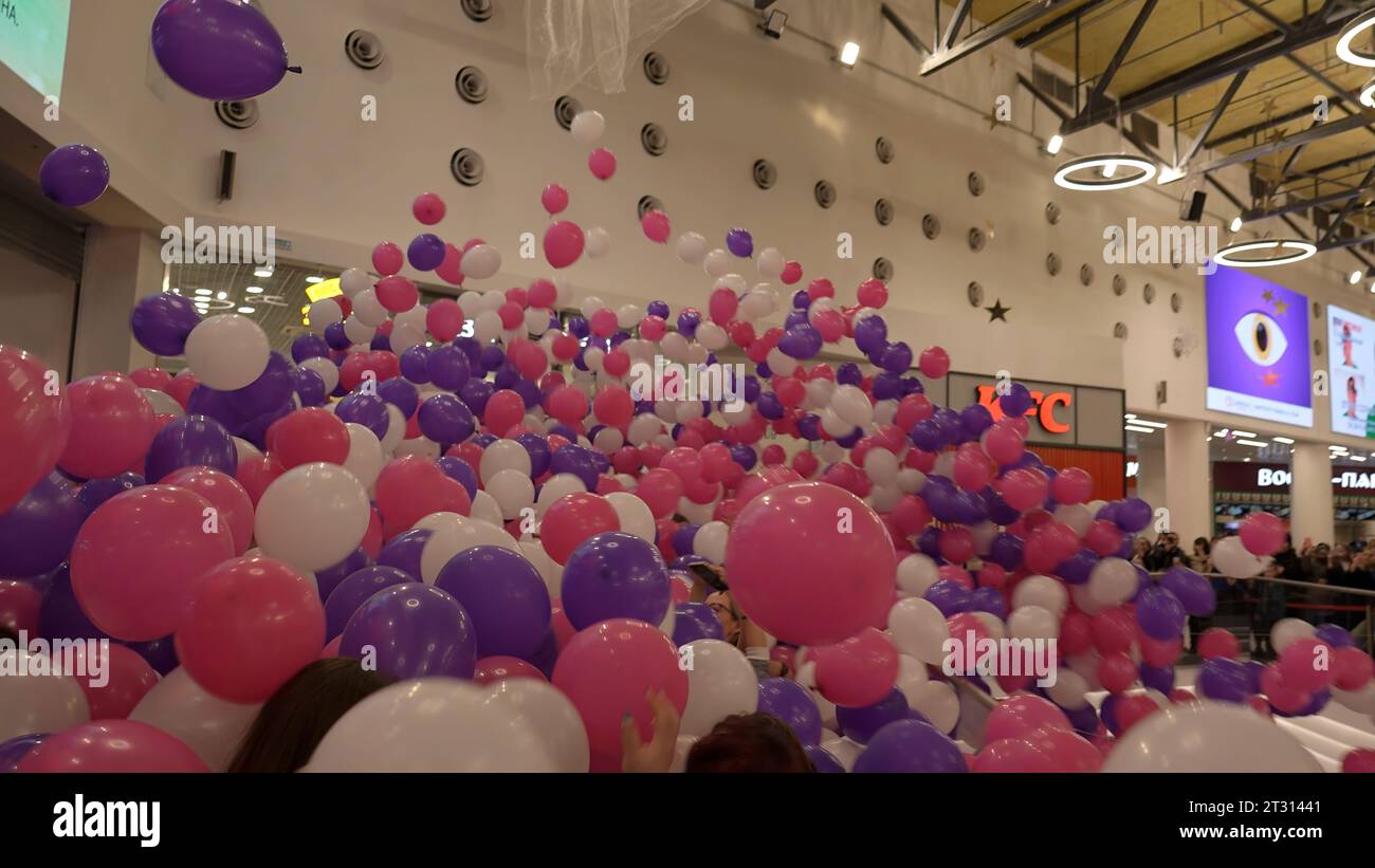 Usa - New York, May 3, 2023: Many pink and lilac air balloons falling ...