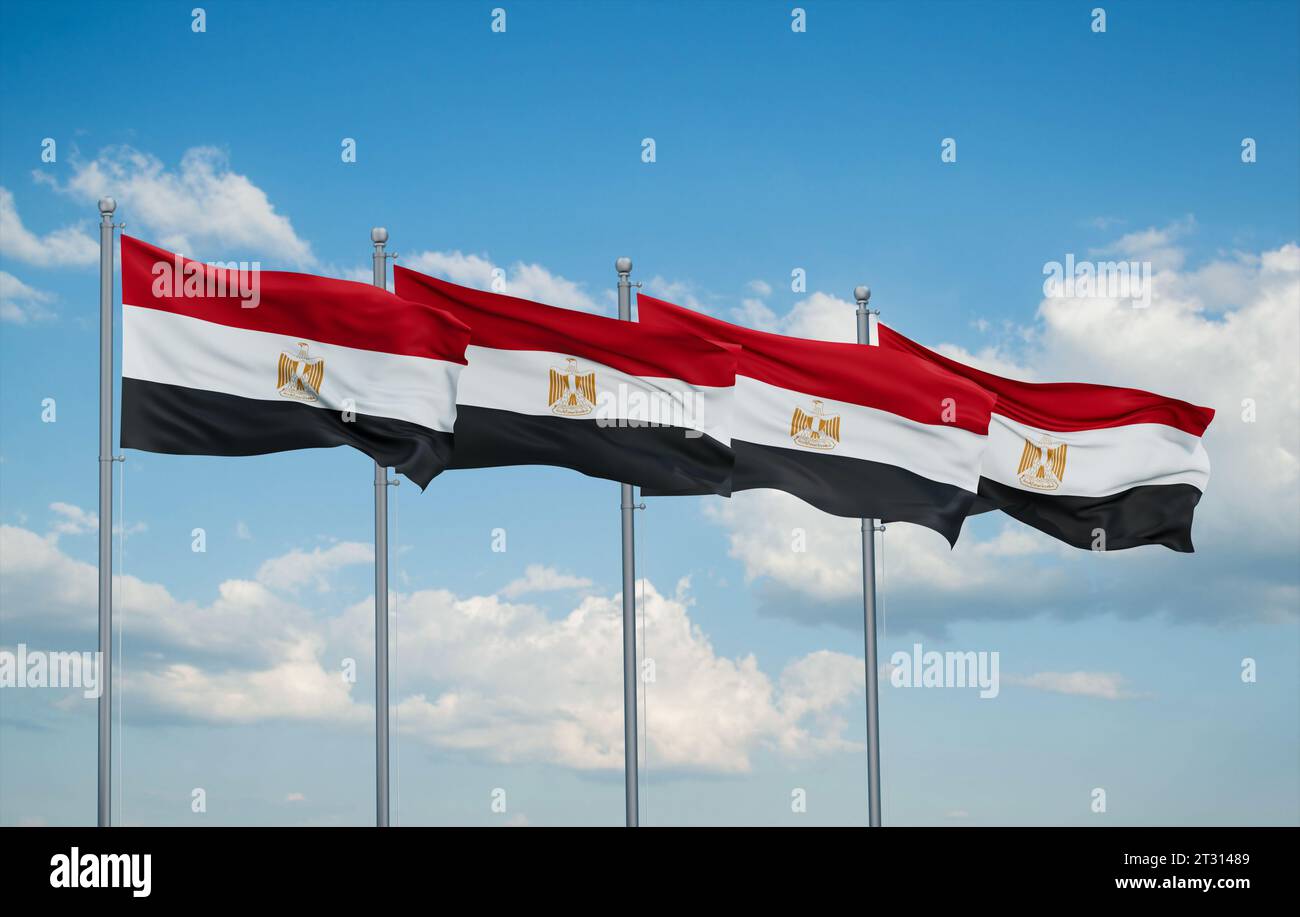 Egypt four flags in row waving together on blue cloudy sky, multiple ...