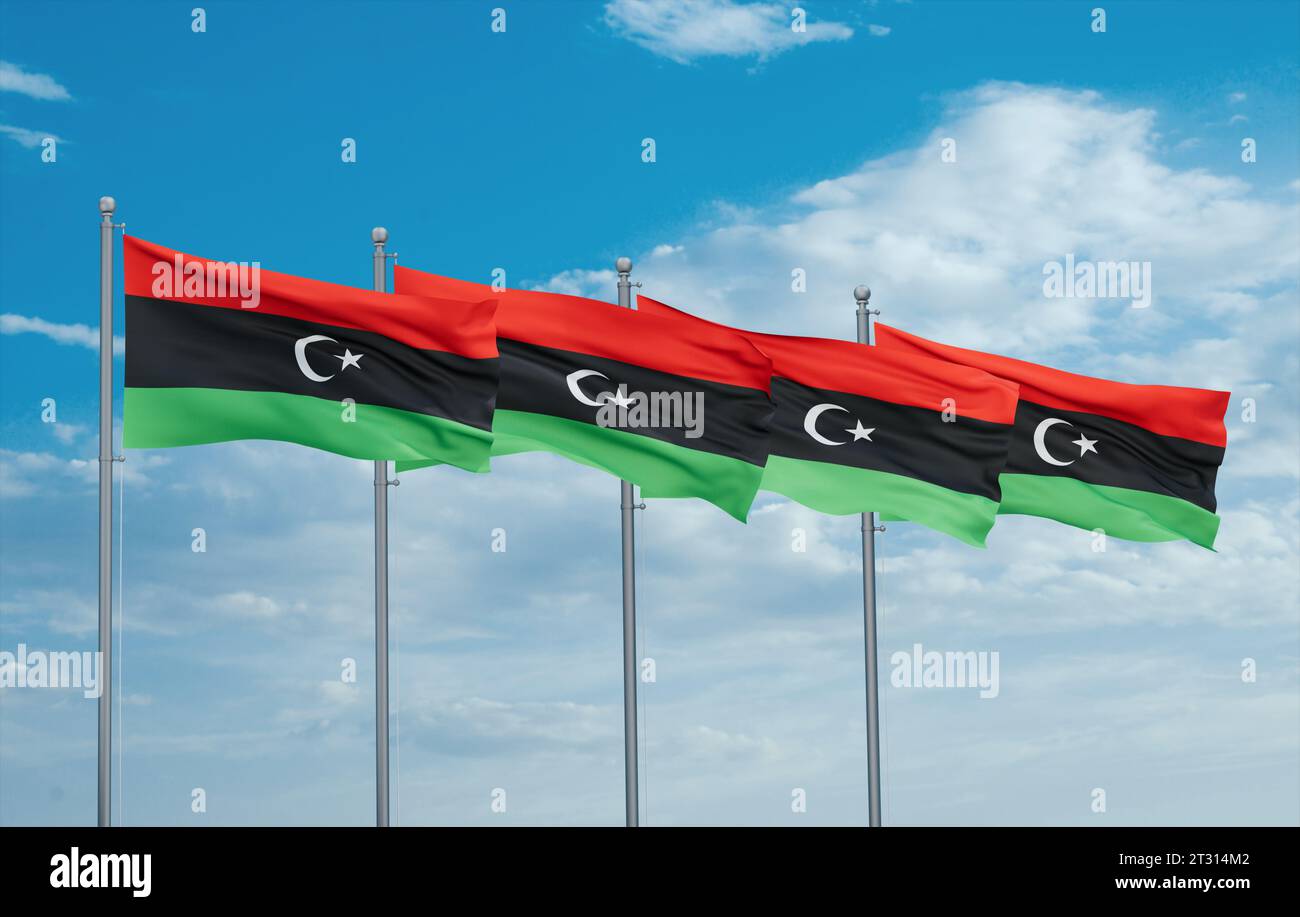 Libya four flags in row waving together on blue cloudy sky, multiple flags in line Stock Photo ...