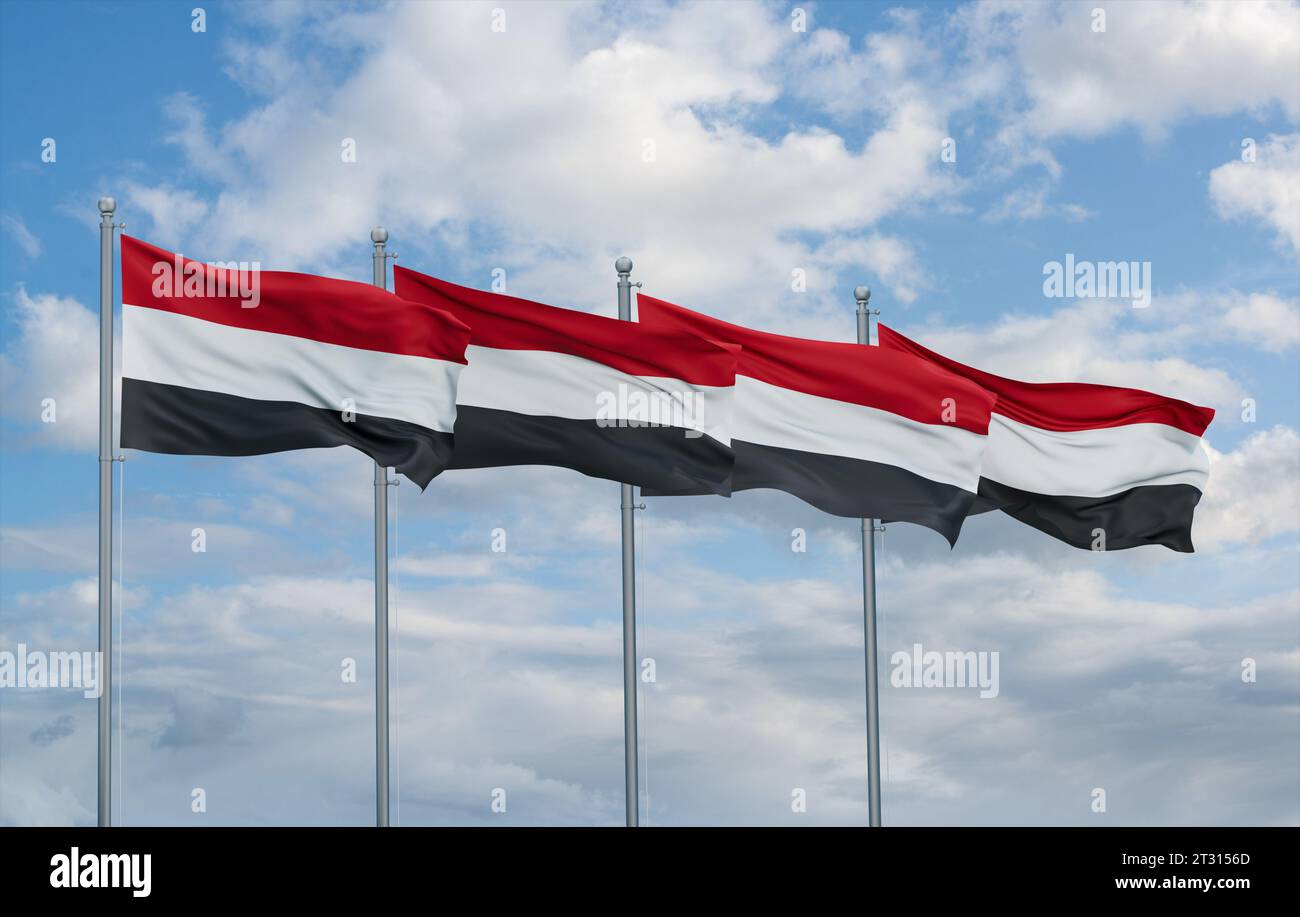 Yemen four flags in row waving together on blue cloudy sky, multiple ...