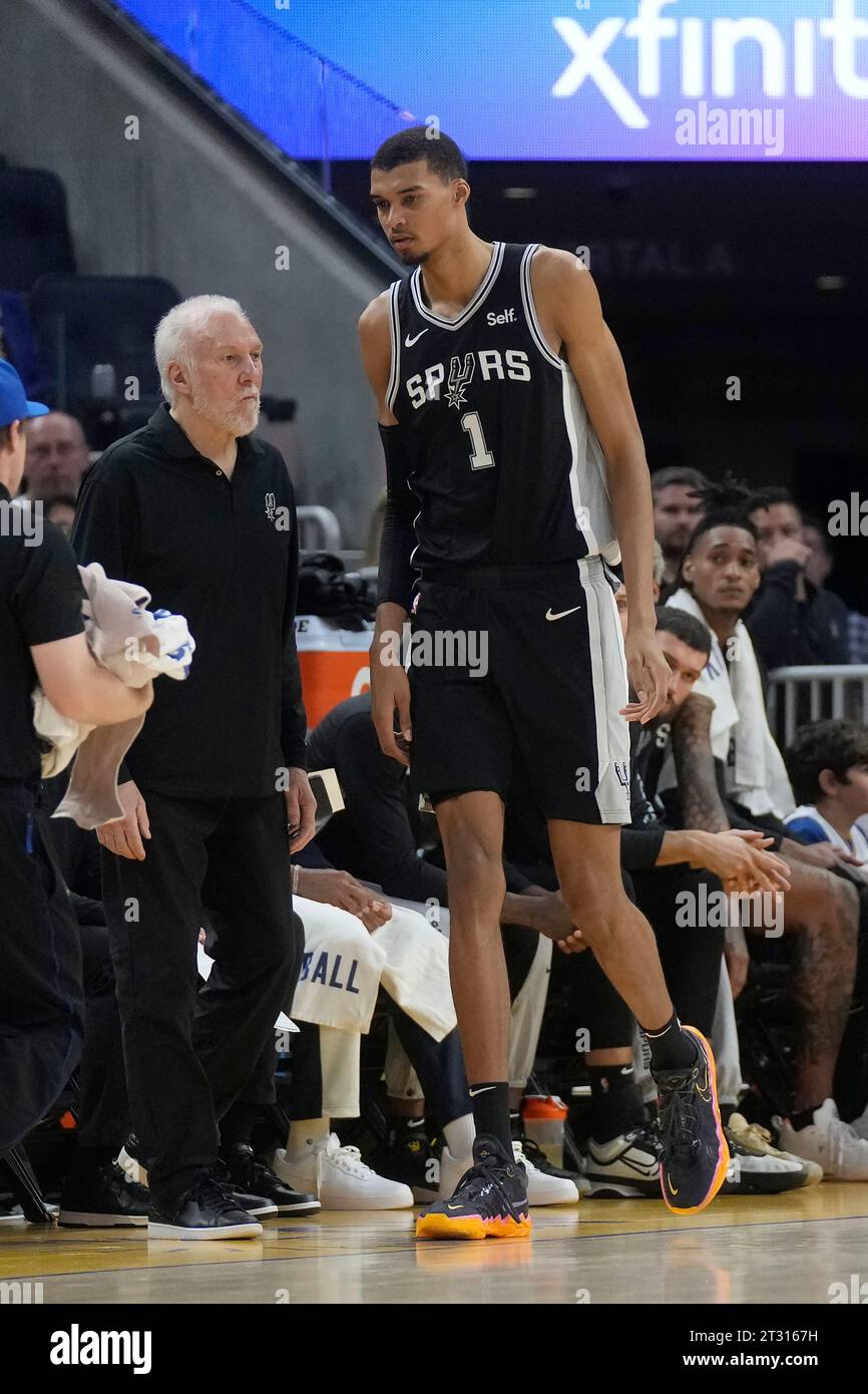 San Antonio Spurs center Victor Wembanyama (1) stands next to head coach Gregg Popovich during ...