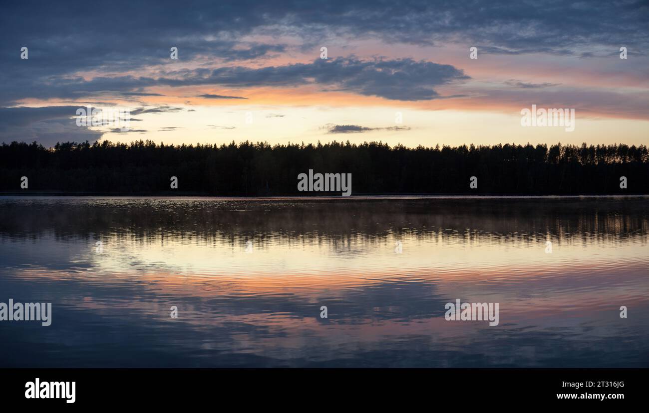 The panoramic view of Baltis Lake calm waters with reflections after ...