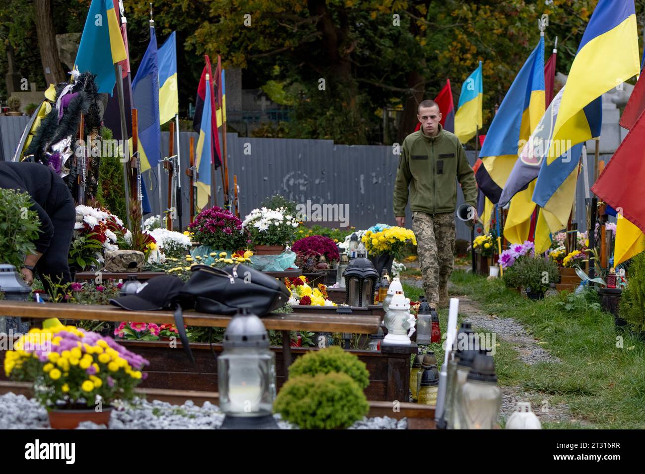 Lviv, Ukraine. 22nd Oct, 2023. A soldier seen with a vase on hand and ...