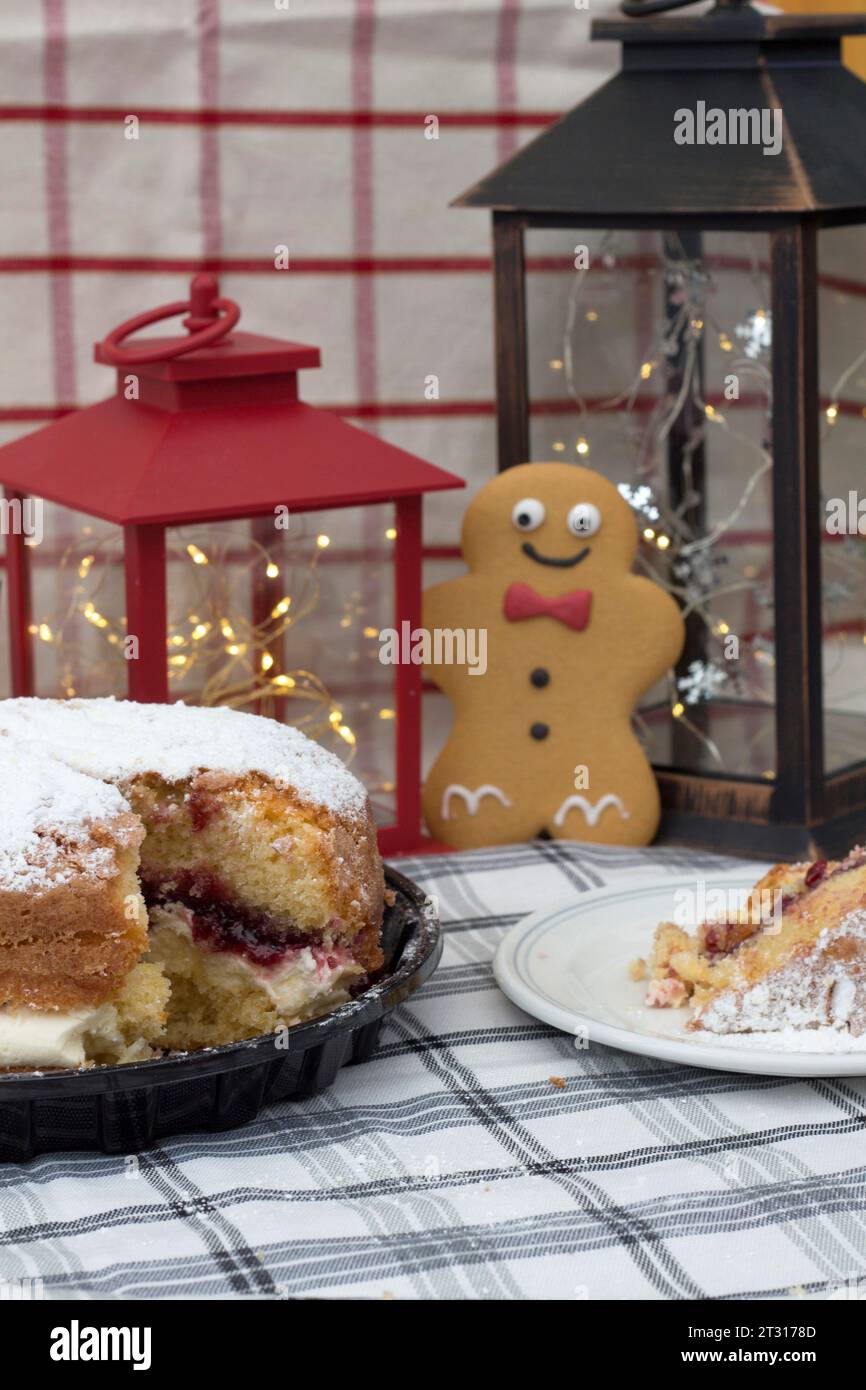 Happy gingerbread man looking at homemade cream and jam cake Stock ...