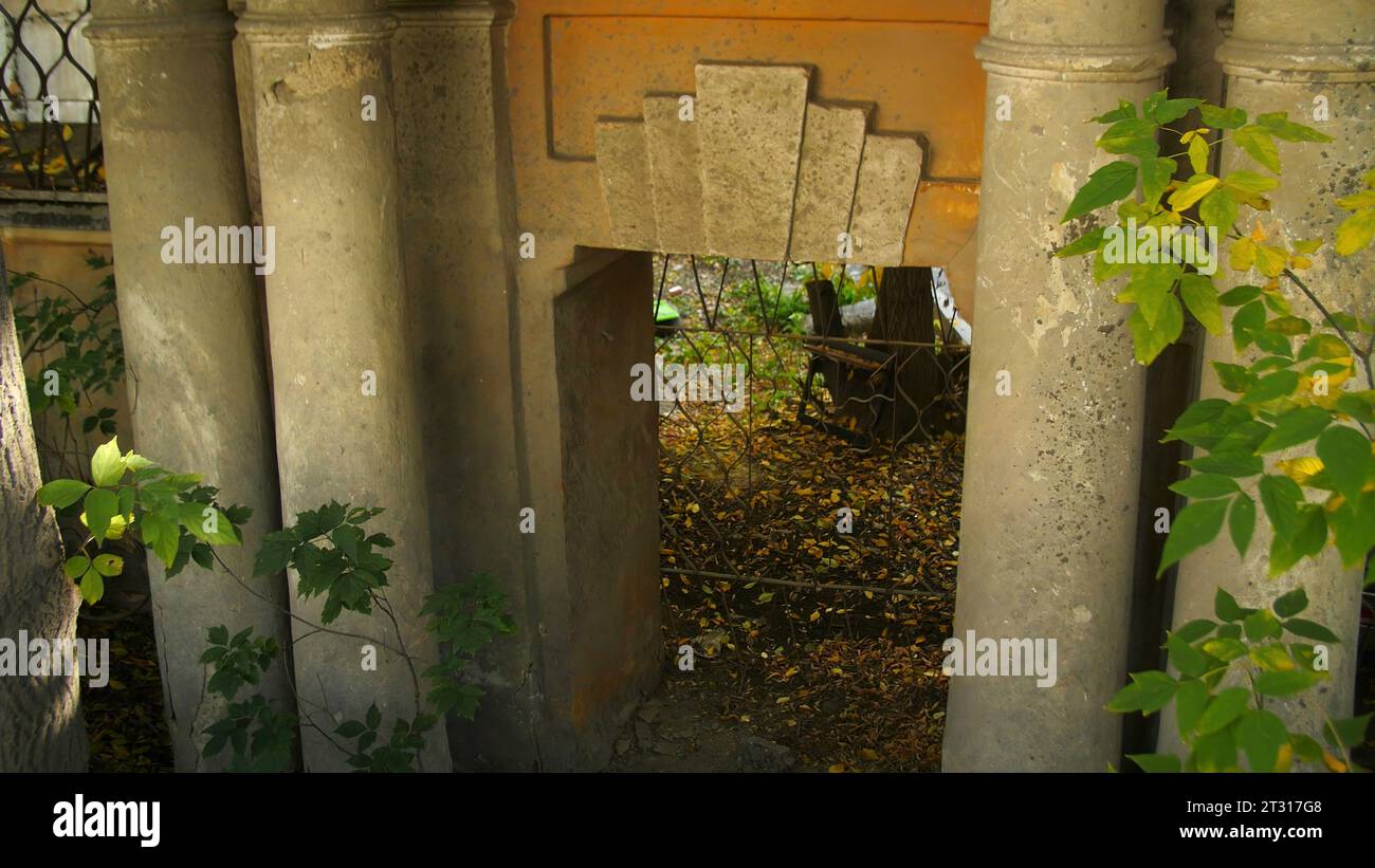 Old arc with columns with green trees growing around. Stock footage ...