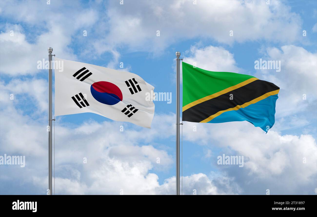 Tanzania and Brazil flags waving together in the wind on blue cloudy sky, two country ...