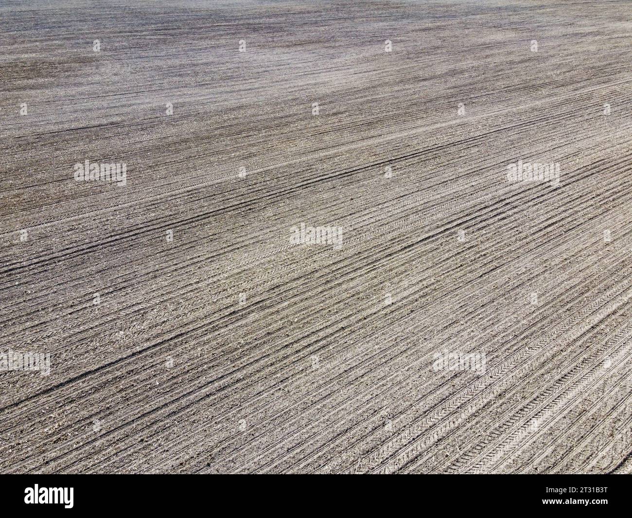 Plowed soil, aerial view, landscape. Lots of traces from vehicles on ...