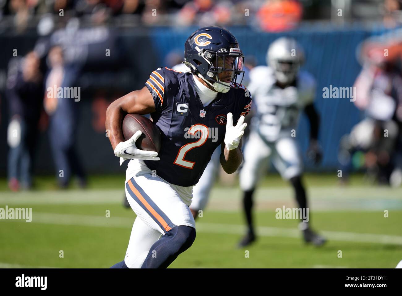 Chicago Bears wide receiver DJ Moore (2) carries the ball against the Las Vegas Raiders in the ...