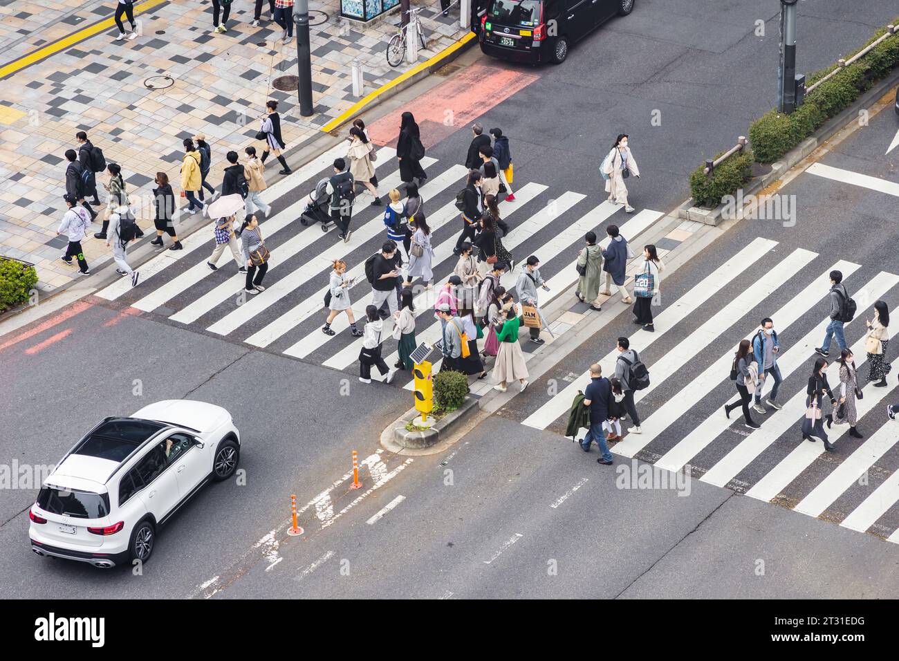 Tokyo, Japan - April 08, 2023: aerial view of a zebra crossing with ...