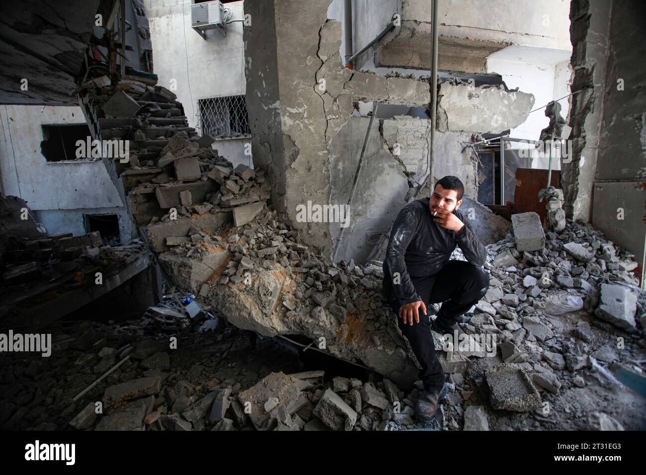 Jenin, Palestine. 22nd Oct, 2023. A Palestinian sits sadly on the ruins ...