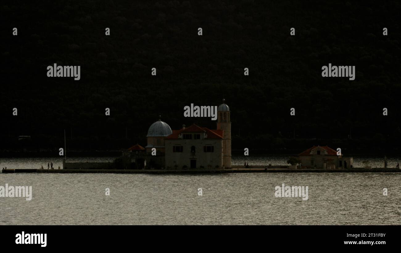 View of a small island. Creative. A green island with towers that ...