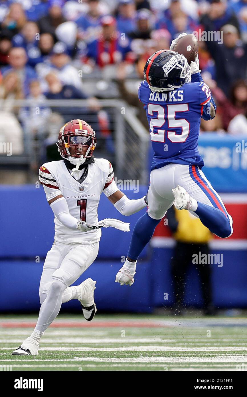 New York Giants cornerback Deonte Banks (25) intercepts a pass intended for Washington ...