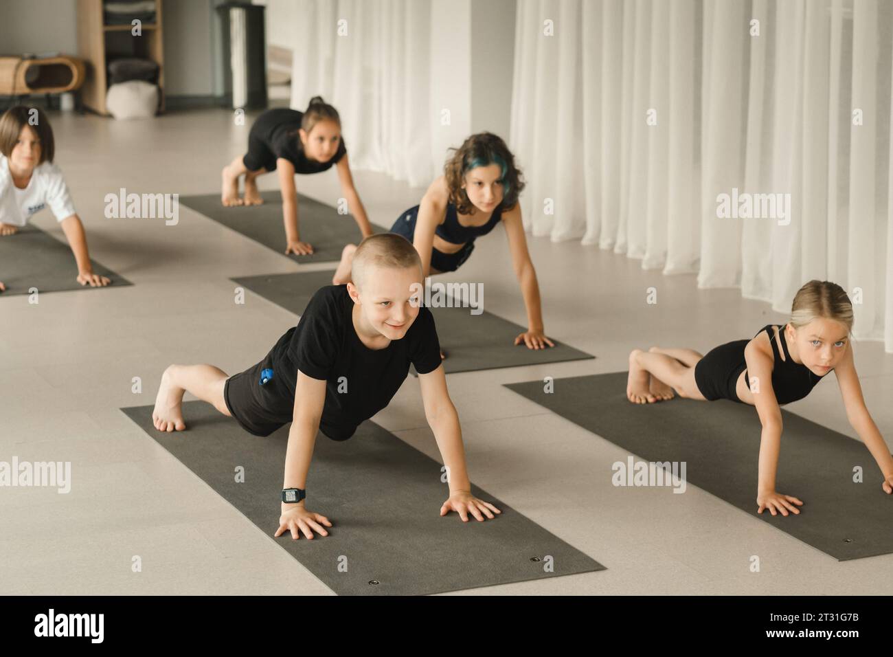 Children do Yoga in the fitness room. Children's gymnastics Stock Photo ...