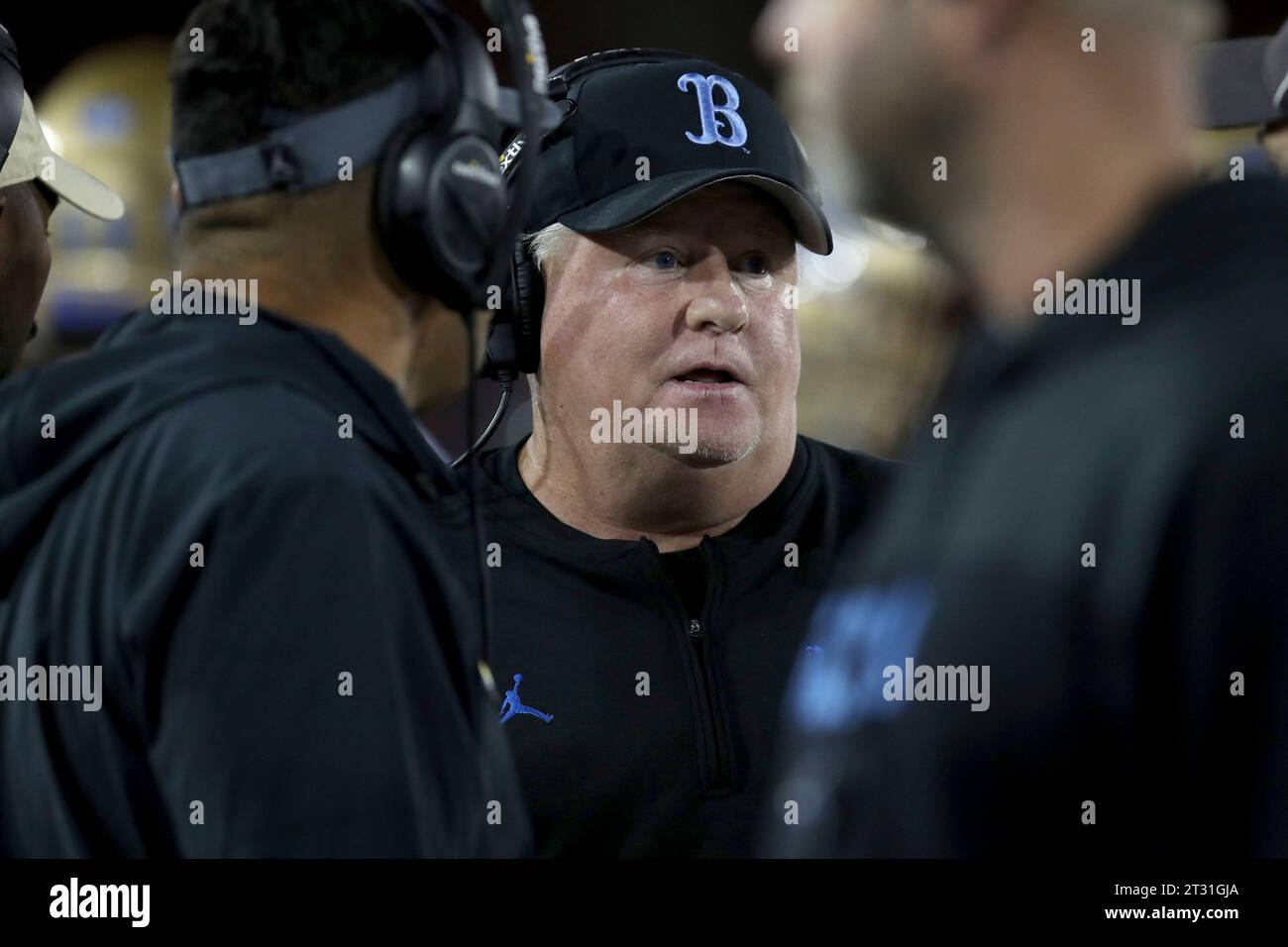 UCLA head coach Chip Kelly stands on the sideline during an NCAA ...