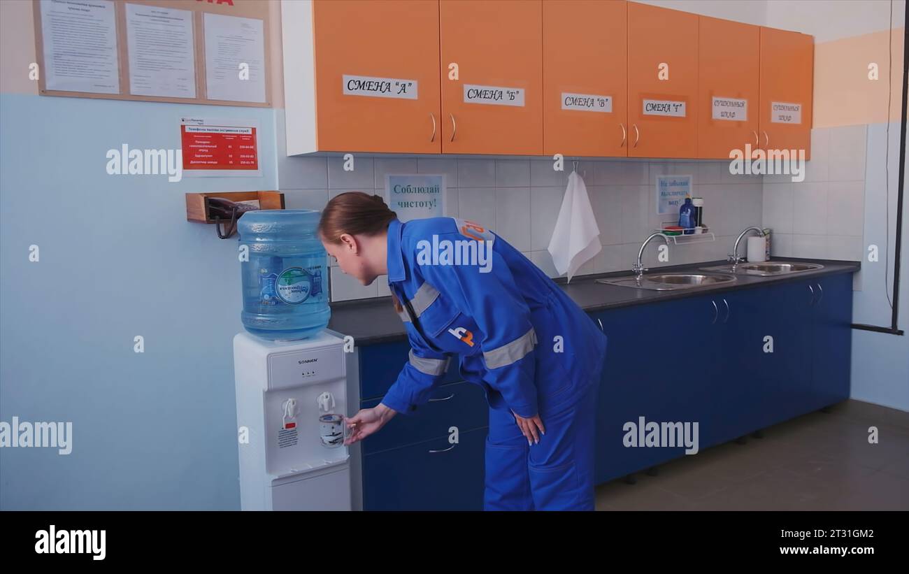 Serbia, Belgrade - June 20, 2023: Woman in overalls at factory. Clip ...