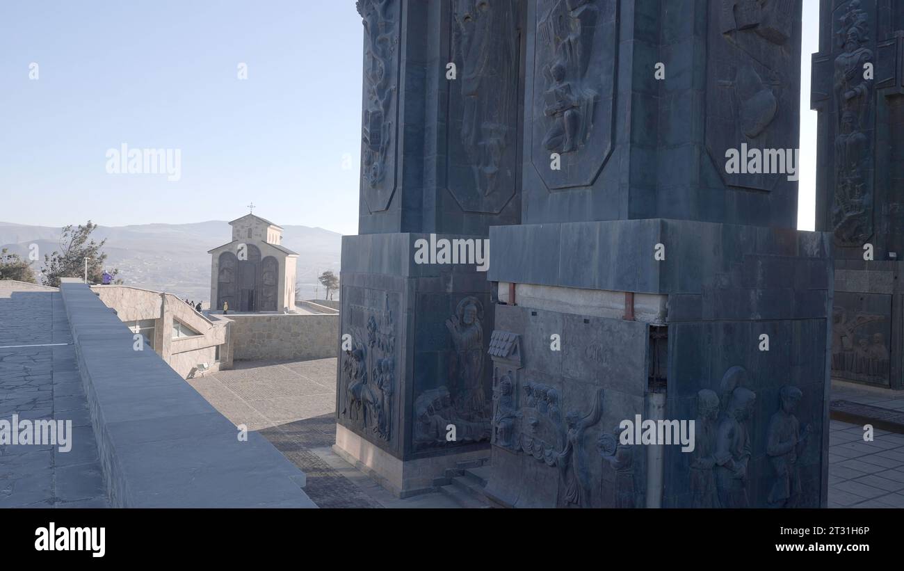 Stone reliefs on ancient pillars. Action. Square pillars with reliefs ...