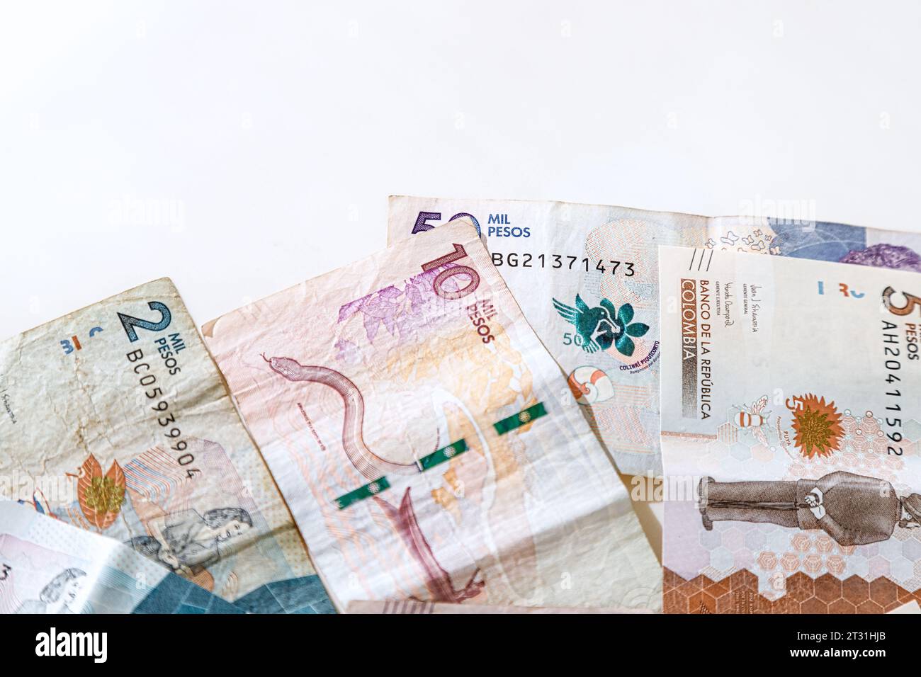 Macro closeup of Colombian peso bills on white background Stock Photo ...