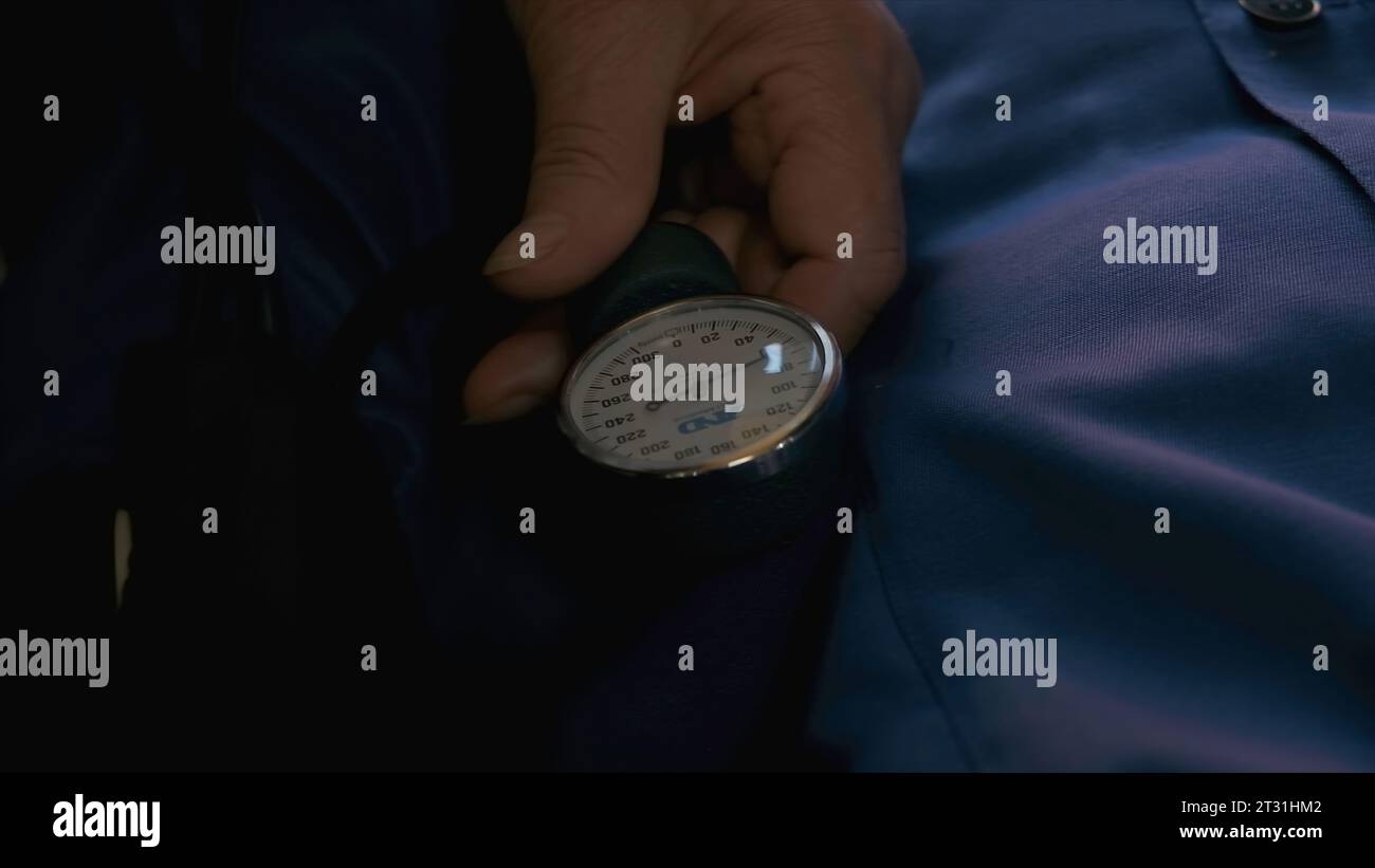 Doctor looking at measurement of tonometer. Clip. Close-up of Doctor ...