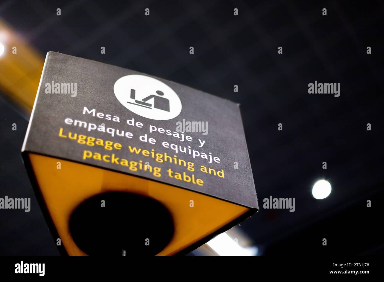 Weighing luggage at an airport hi-res stock photography and images - Alamy