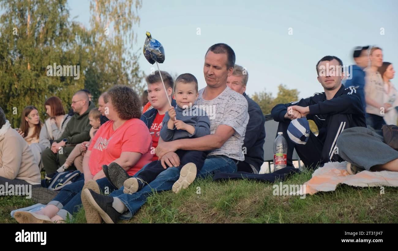 Serbia, Belgrade - June 20, 2023: People are sitting on grass and ...
