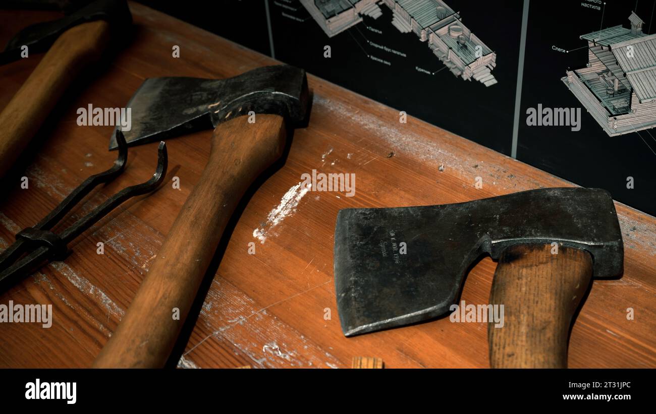 Weapons lying on the table. Media. Axes with sharpened noses that lie ...