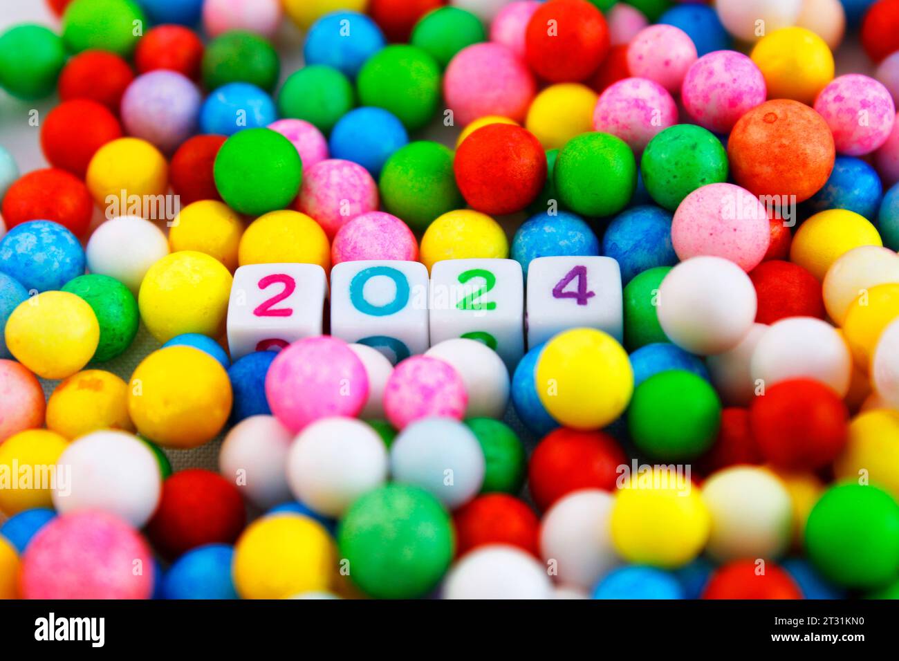 Year 2024, cubes with numbers surrounded by colorful spheres Stock ...