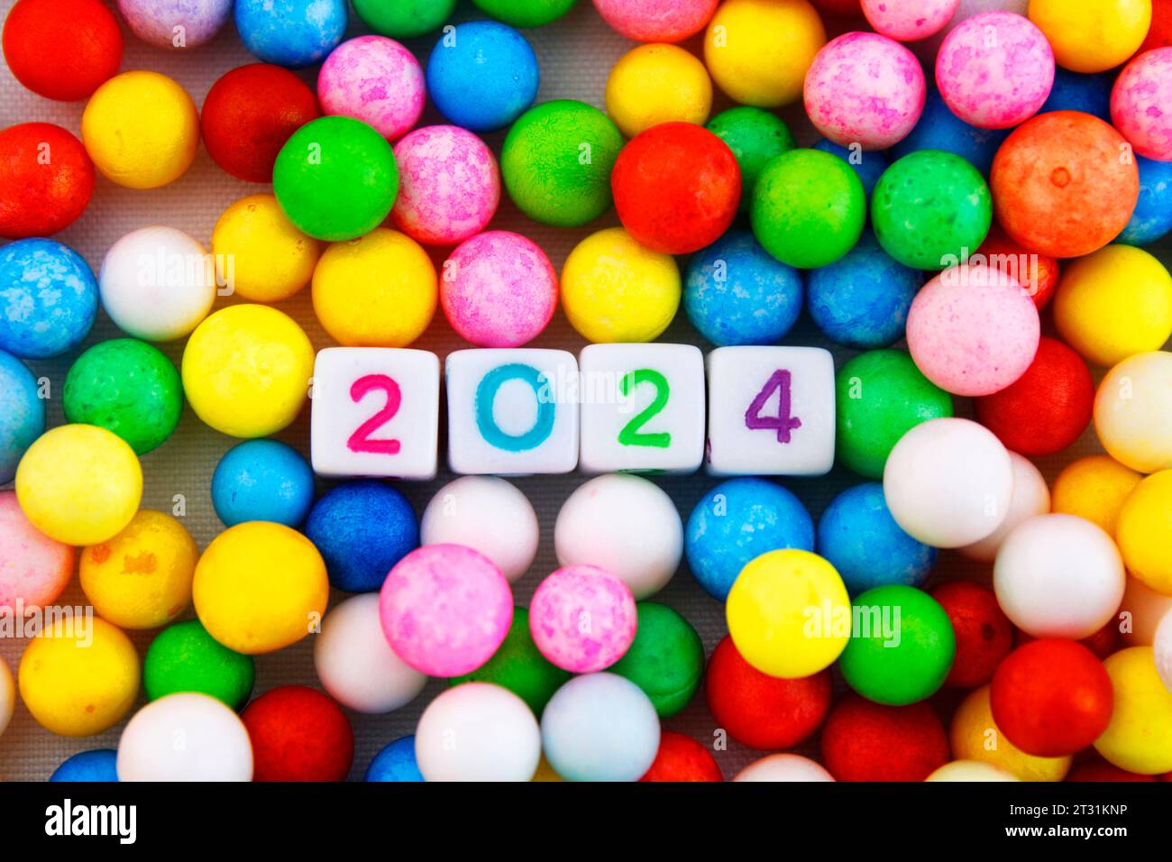 Year 2024, cubes with numbers surrounded by spheres of different colors ...