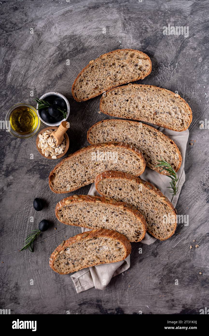 Baked sourdough bread from whole grain flour and pumpkin seeds on a ...