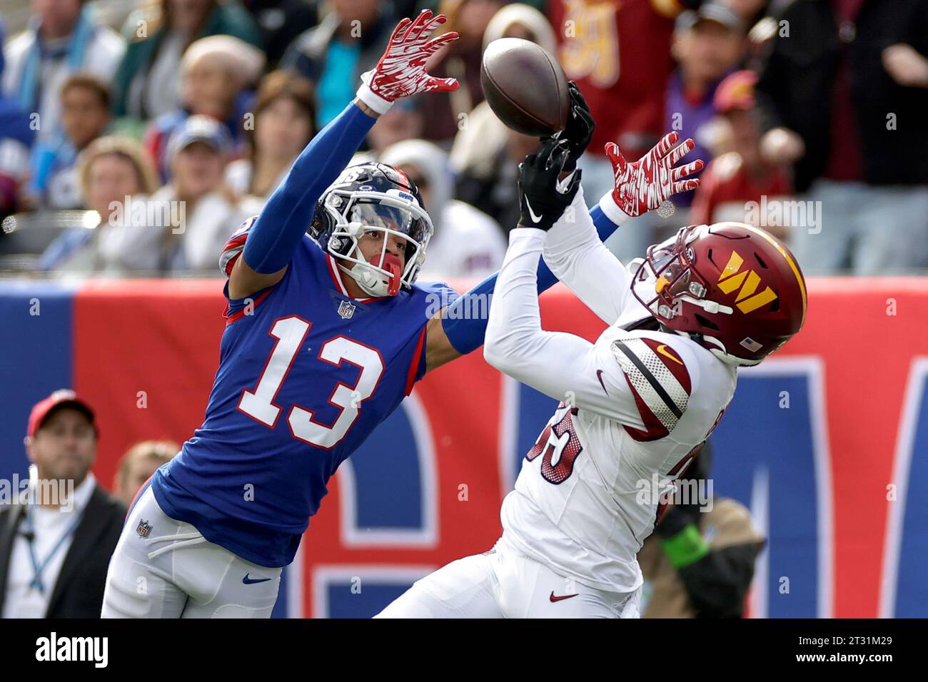 New York Giants wide receiver Jalin Hyatt (13) prevents an interception ...