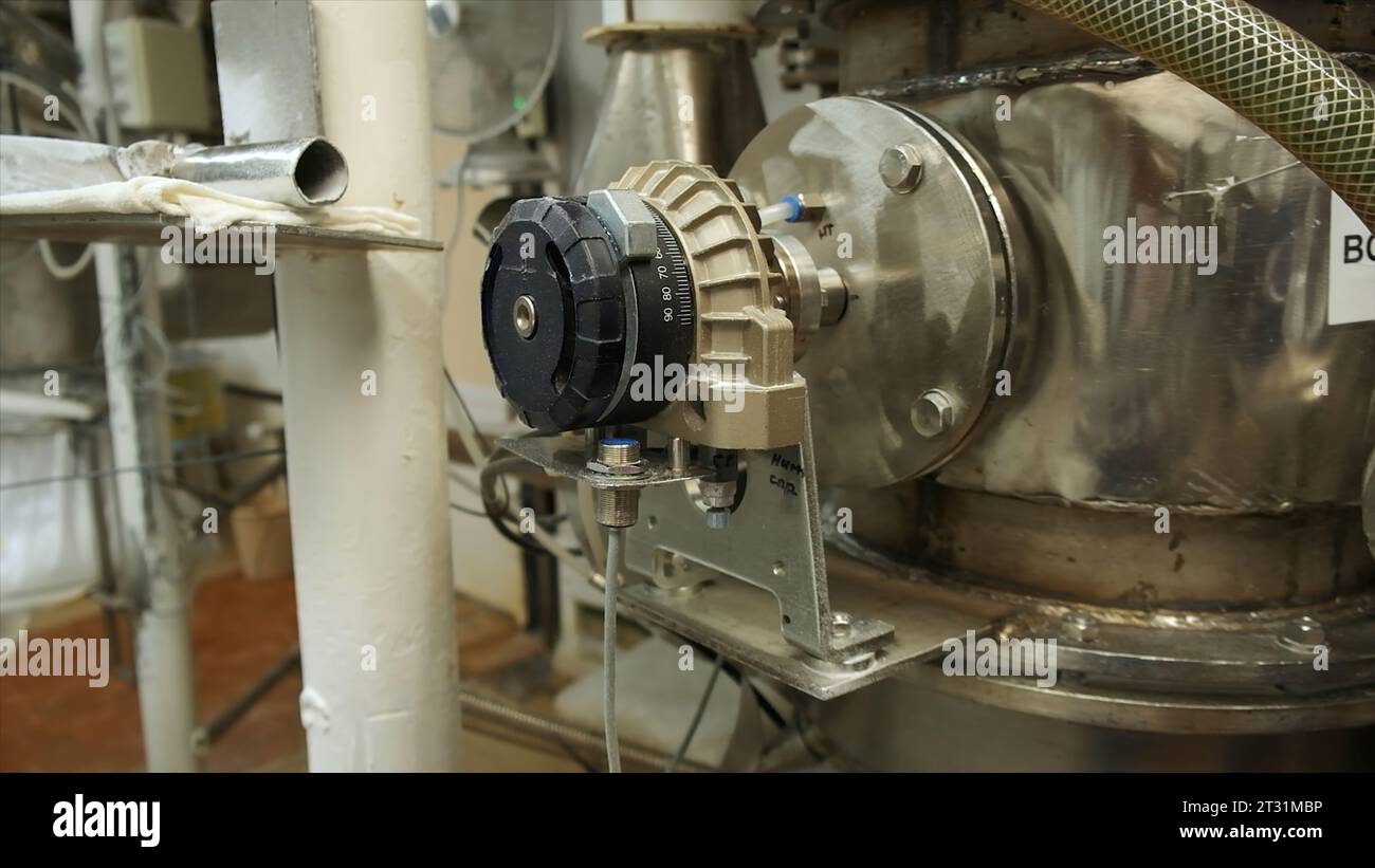 Close-up of rotating valve of industrial tank. Clip. Industrial ...