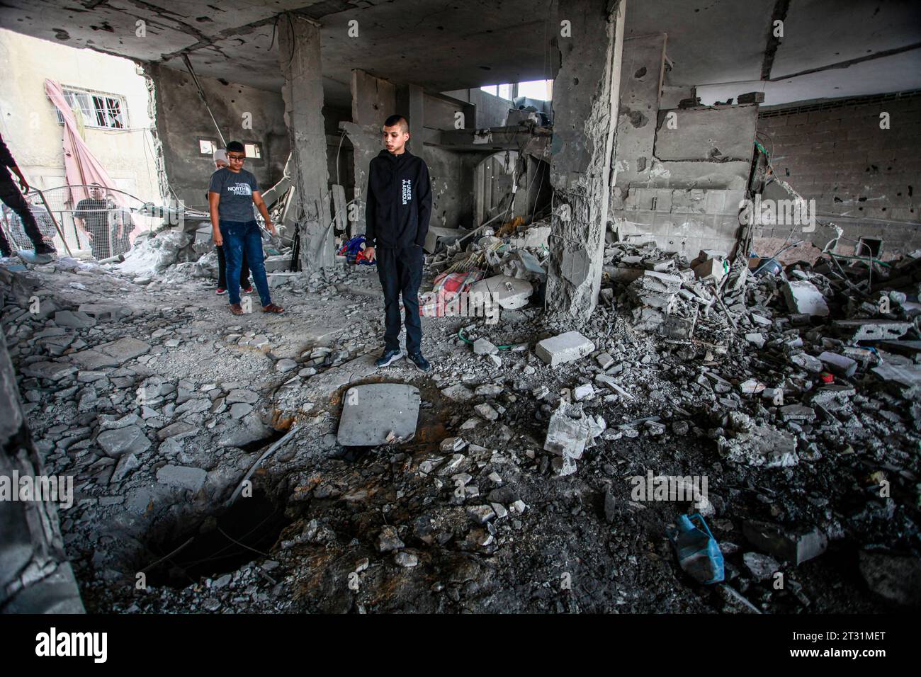 Jenin, Palestine. 22nd Oct, 2023. Palestinians inspect the damage to a ...