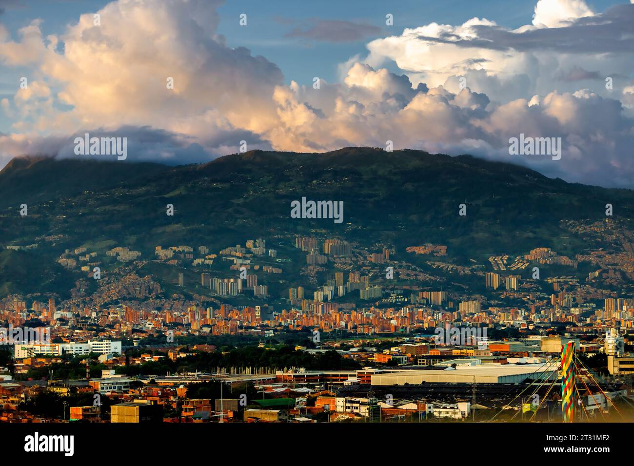 Hill with buildings in Medellin, Colombia, during sunset Stock Photo ...
