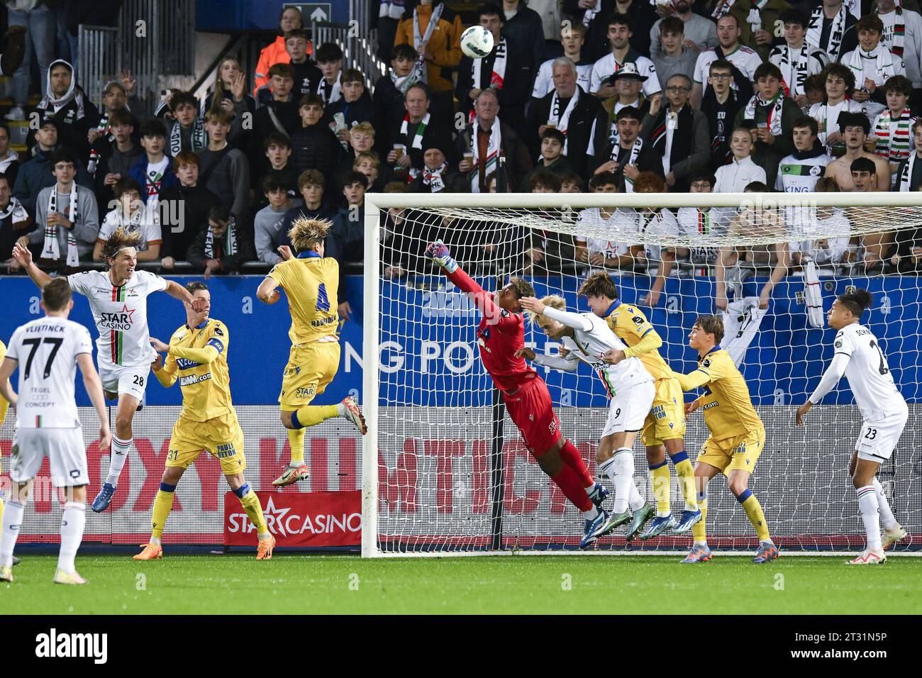 Leuven, Belgium. 22nd Oct, 2023. STVV's goalkeeper Zion Suzuki and OHL's Jonathan Braun Brunes ...