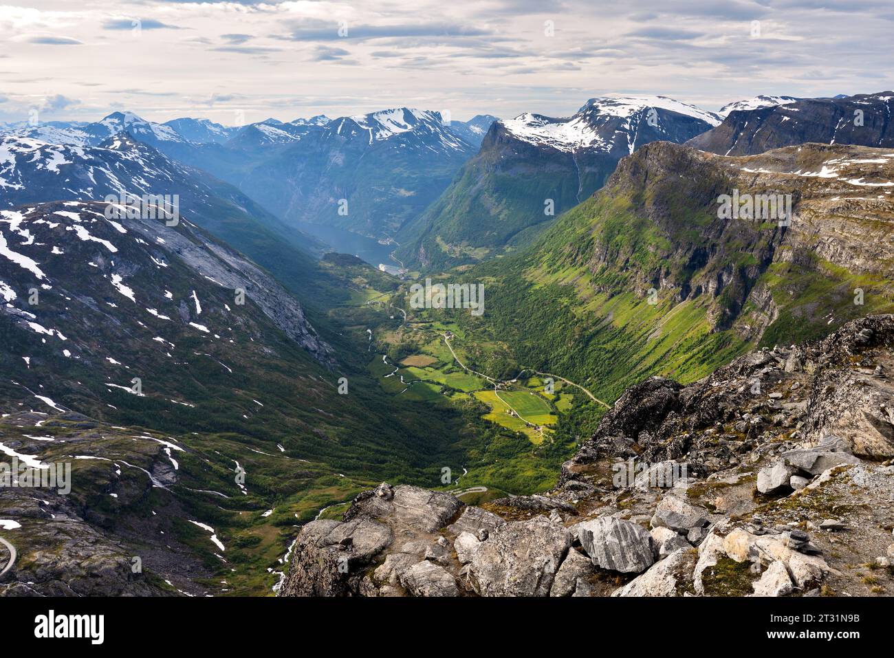 Mountains landscape at sunset, Geirangerfjord and winding road ...