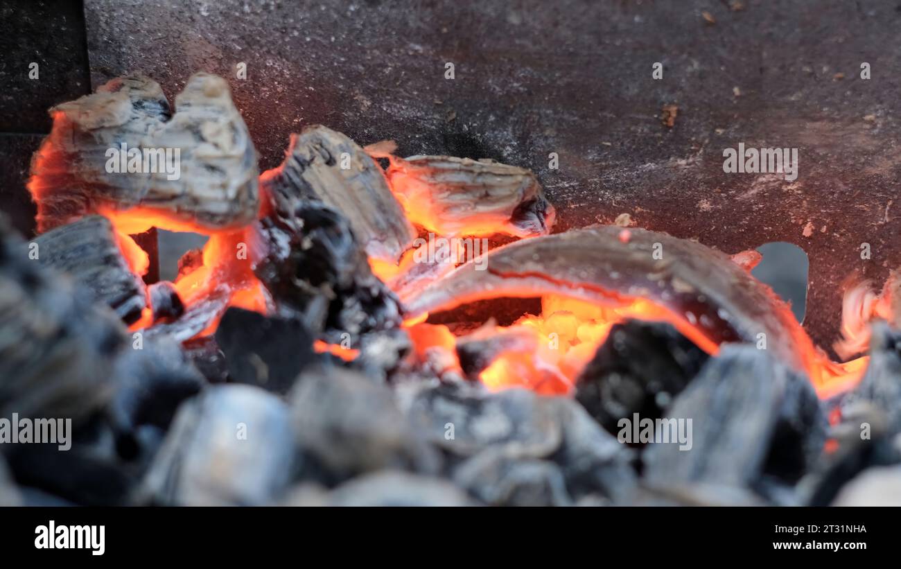 Burning coals. Concept. Burnt coals that burn and smoke Stock Photo - Alamy