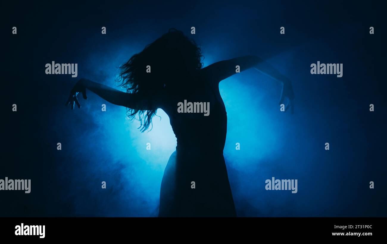 Contemporary choreography dance woman spotlight Stock Photo - Alamy