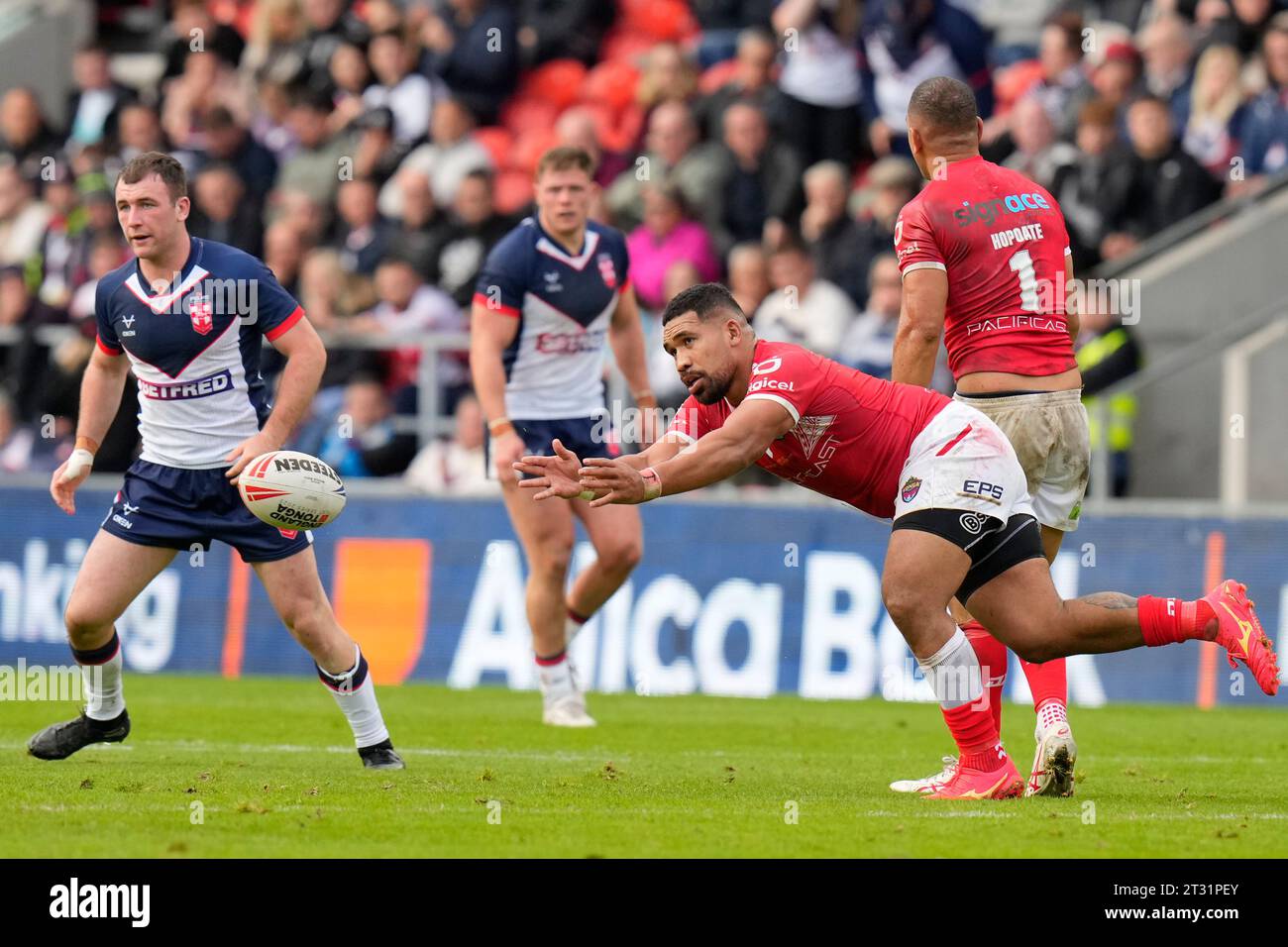 Siliva Havili #9 of Tonga passes the ball during the Rugby League ...