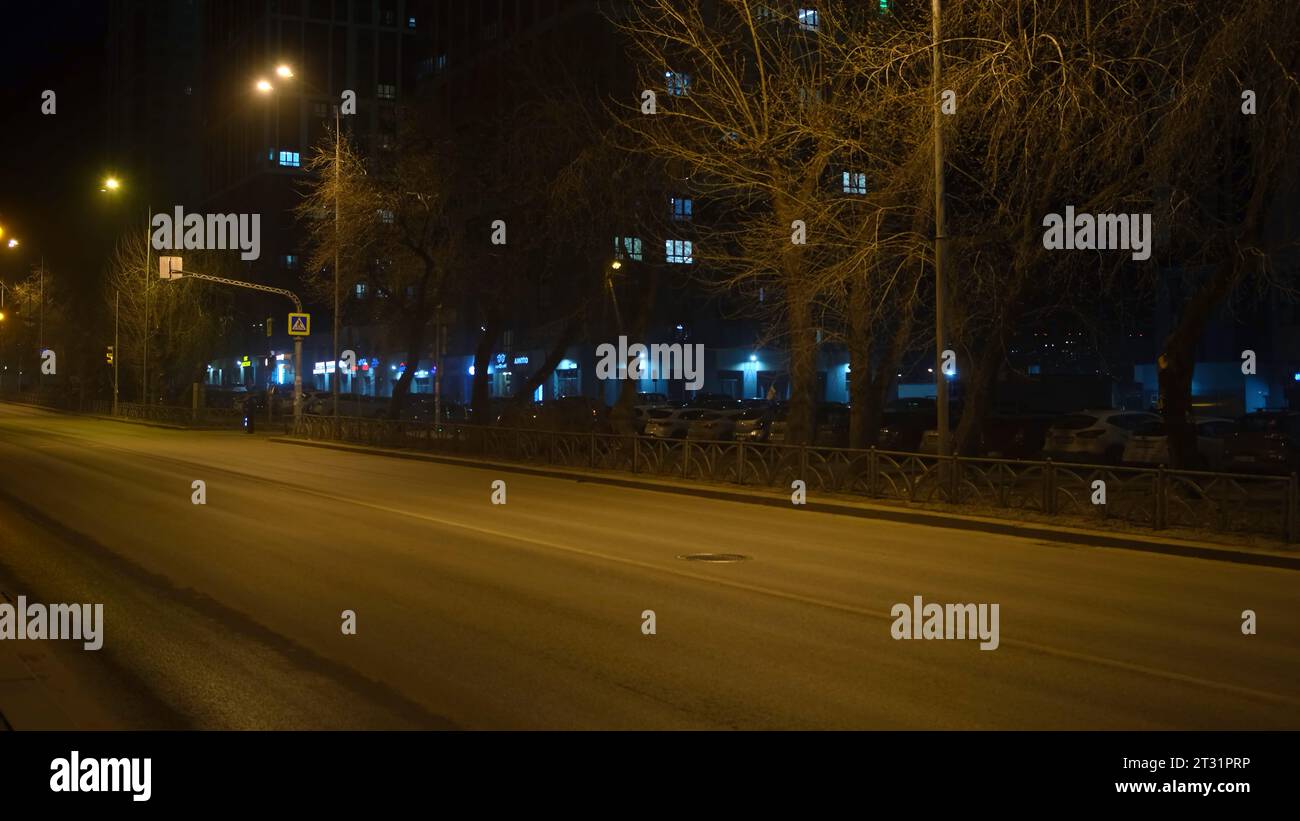 Empty street at night with road and lanterns. Concept. Lights are ...