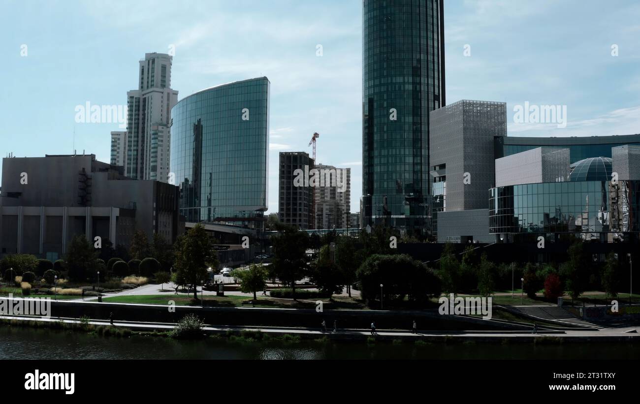 A built-up city under the bright sun. Stock footage. Huge glass offices ...