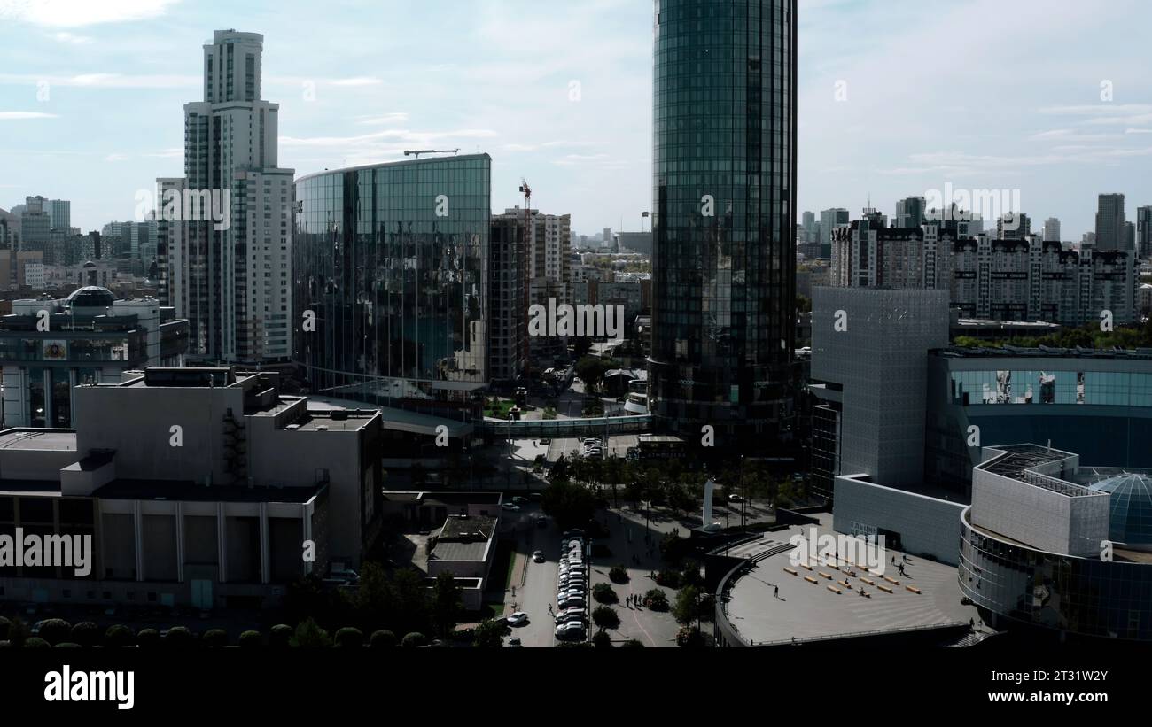 A built-up city under the bright sun. Stock footage. Huge glass offices ...