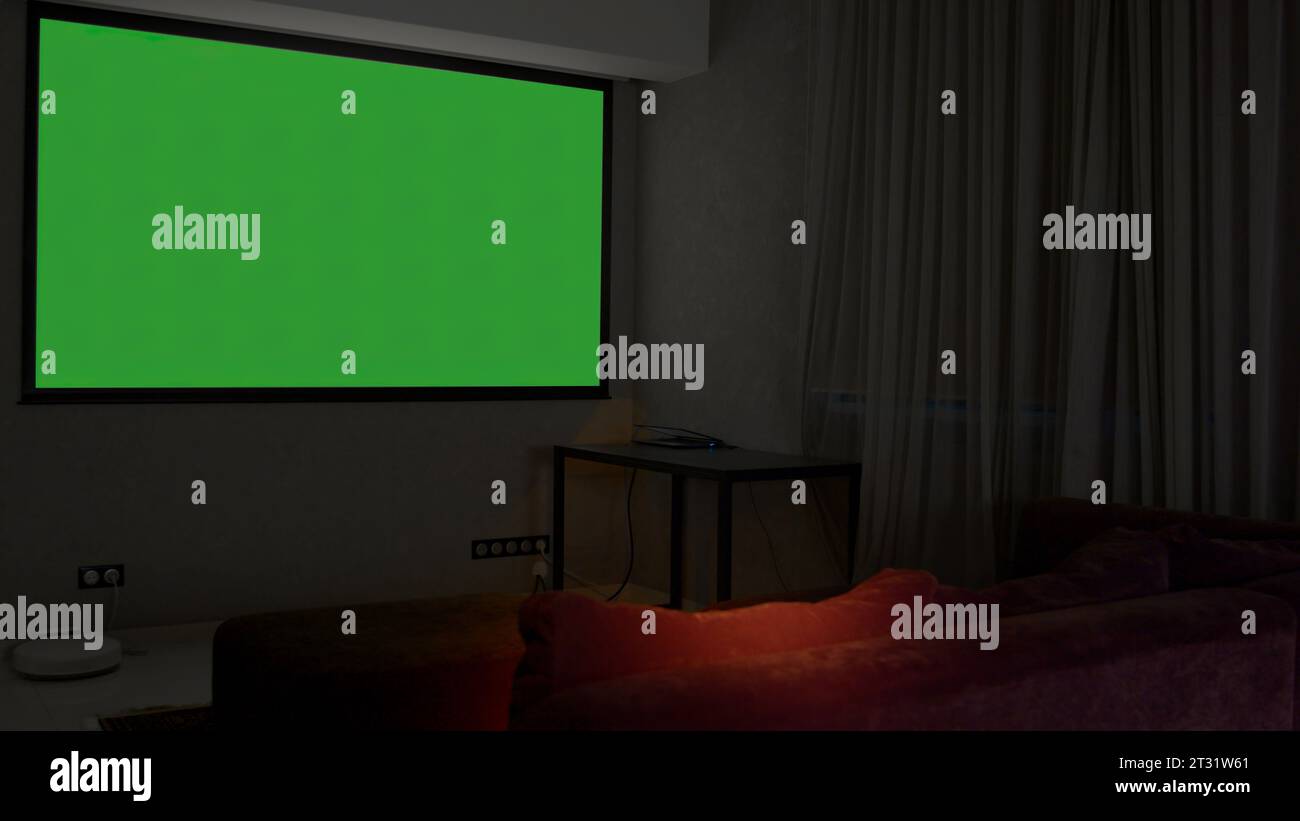 A room with a large green screen. Media. A large spacious room with a ...