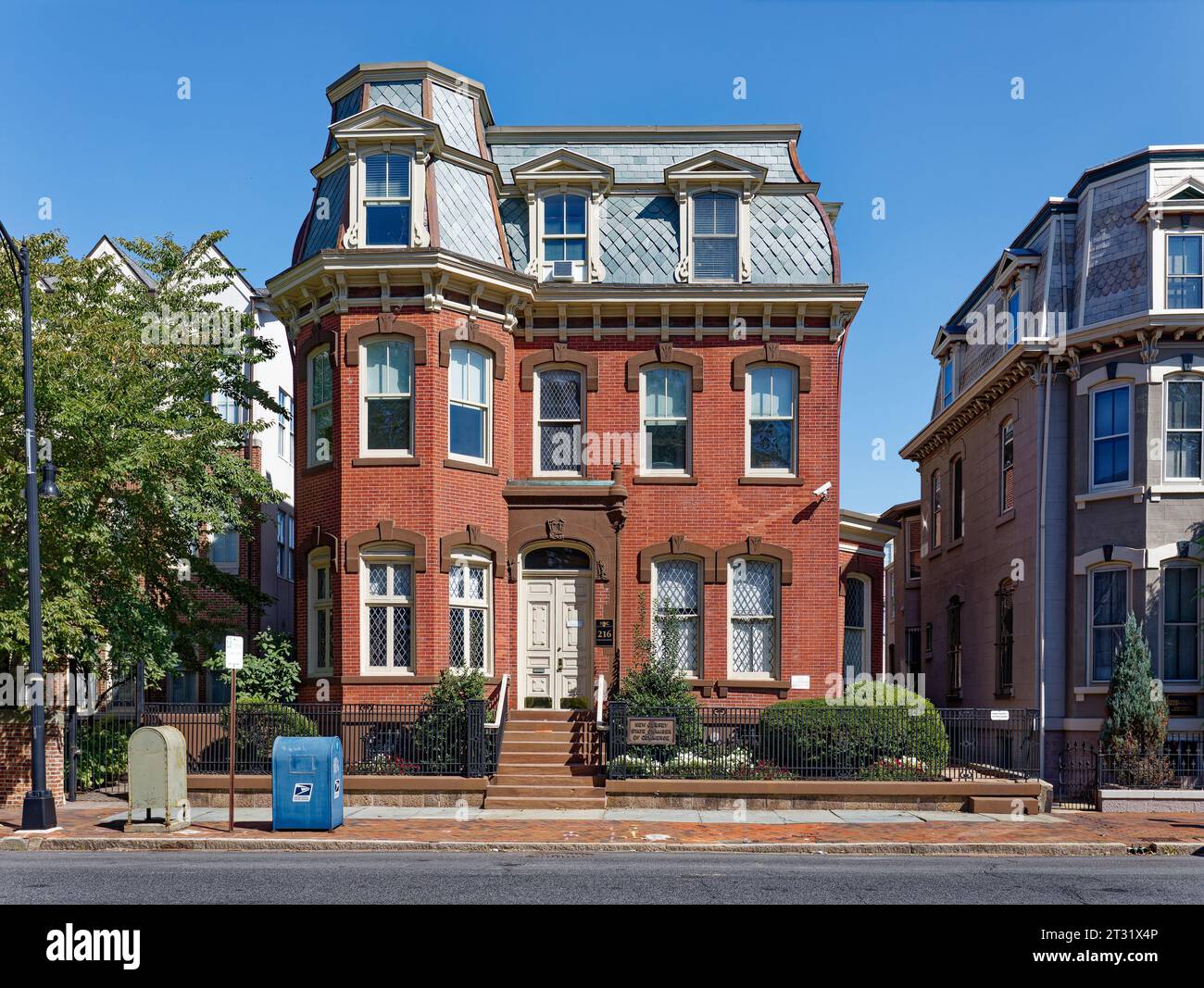 Downtown Trenton: A brick townhouse with Mansard roof and stone details ...