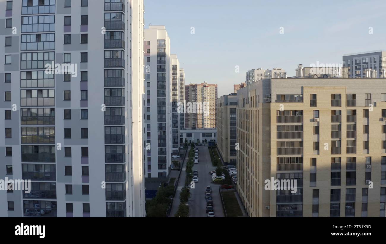 Apartment buildings of a city sleeping area. Stock footage. Long street ...