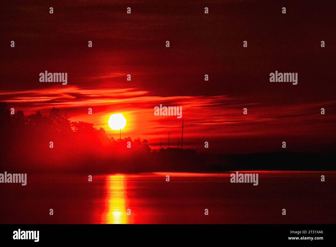 sunrise over calm water - Lysaker Stock Photo - Alamy