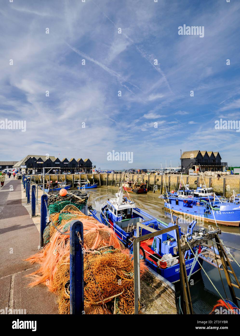 Editorial Use Only - Low tide in Whitstable harbour, fishing boats ...