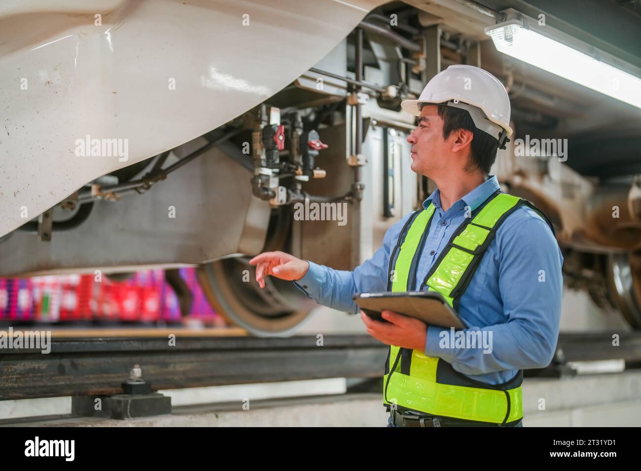 Engineer inspecting locomotive hi-res stock photography and images - Alamy